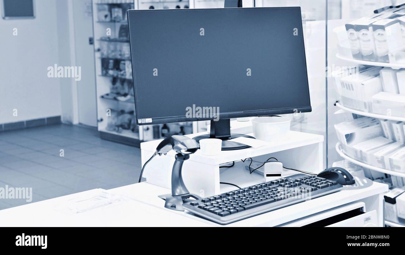 Cash desk - computer and monitor in a pharmacy. Interior of drug and ...
