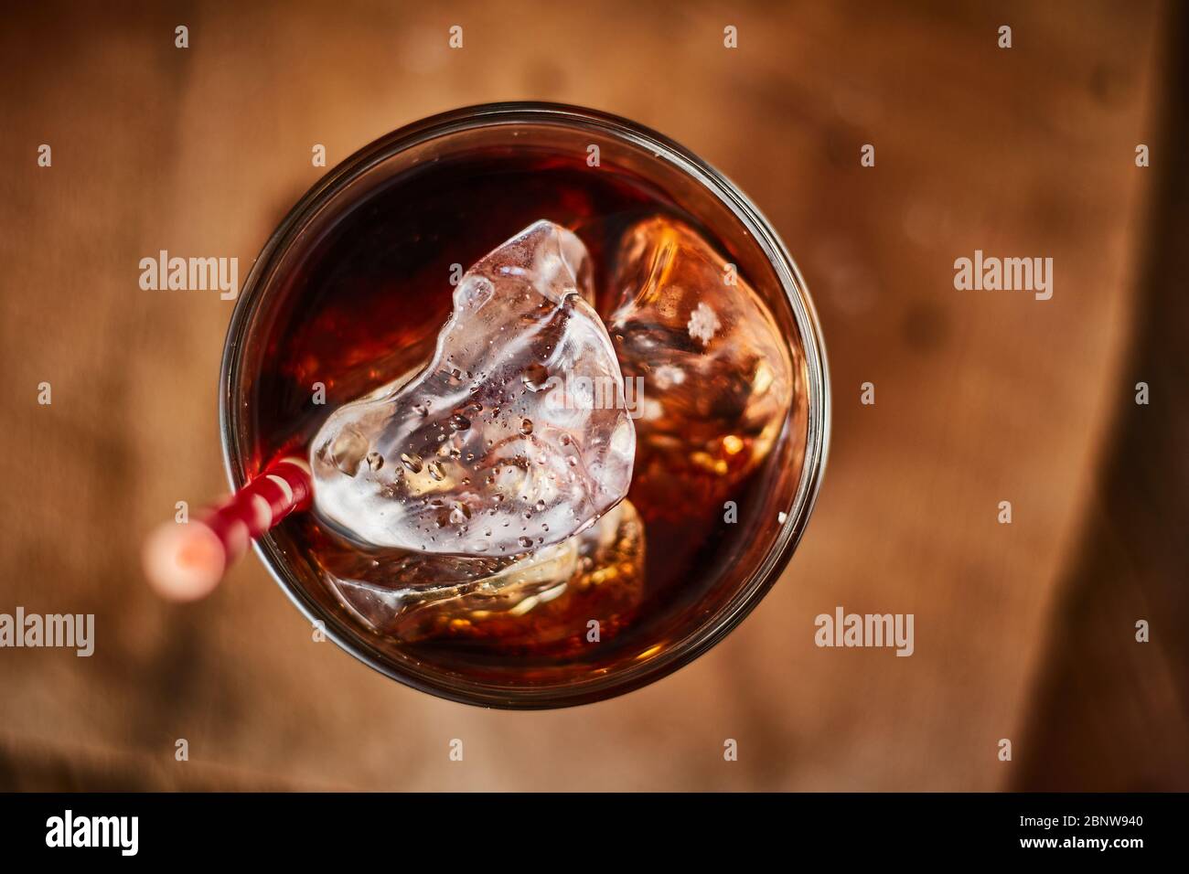 Close up glass of refreshing cola with ice on table Stock Photo - Alamy