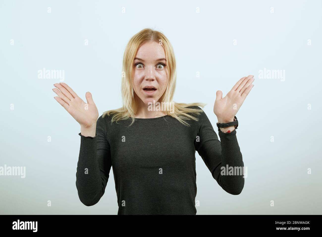 Surprised Girl Holds Her Hands Wide, Raised Them Up. Concept Of ...