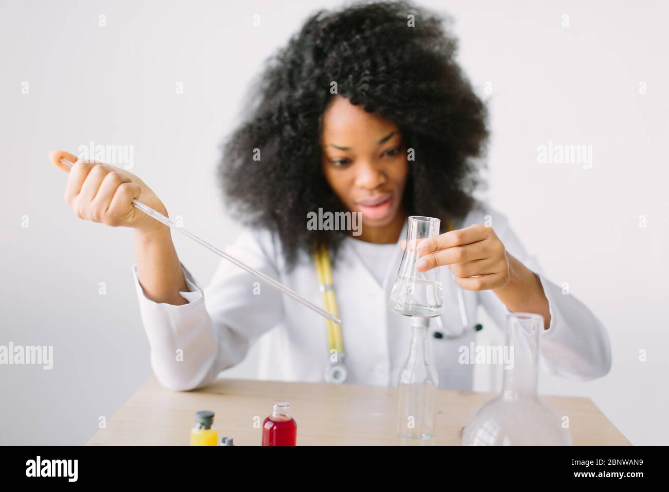 Portrait of a young beautiful African American girl researcher ...