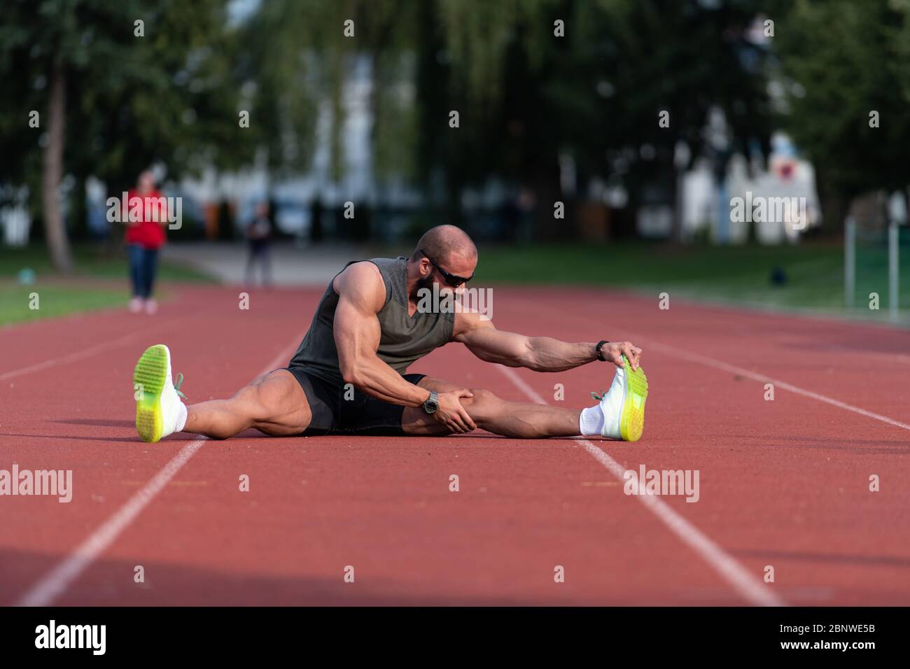 Young Athlete Man Relax and Strech Ready for Run at Athletics Race ...