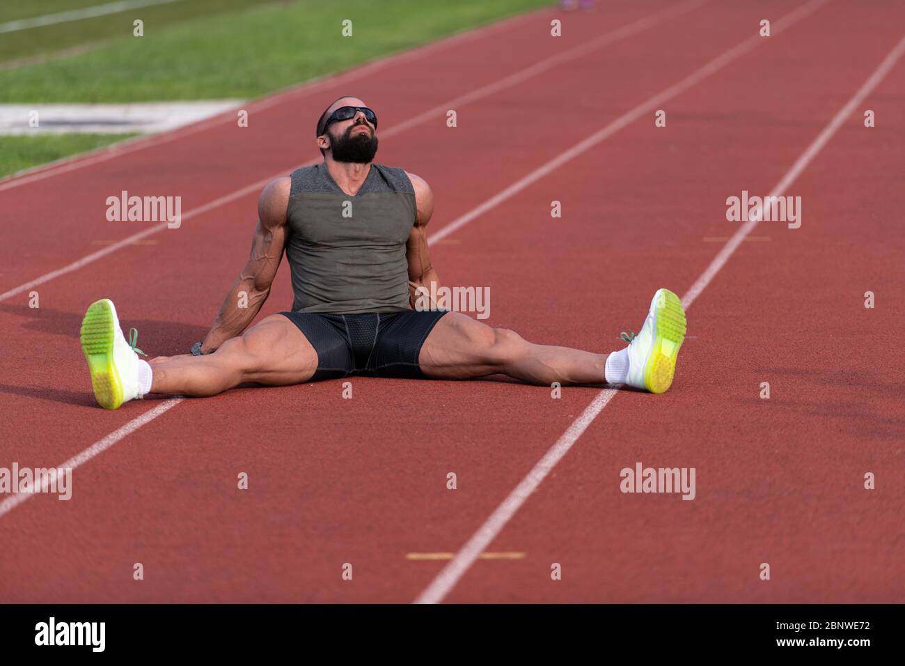 Young Athlete Man Relax and Strech Ready for Run at Athletics Race ...