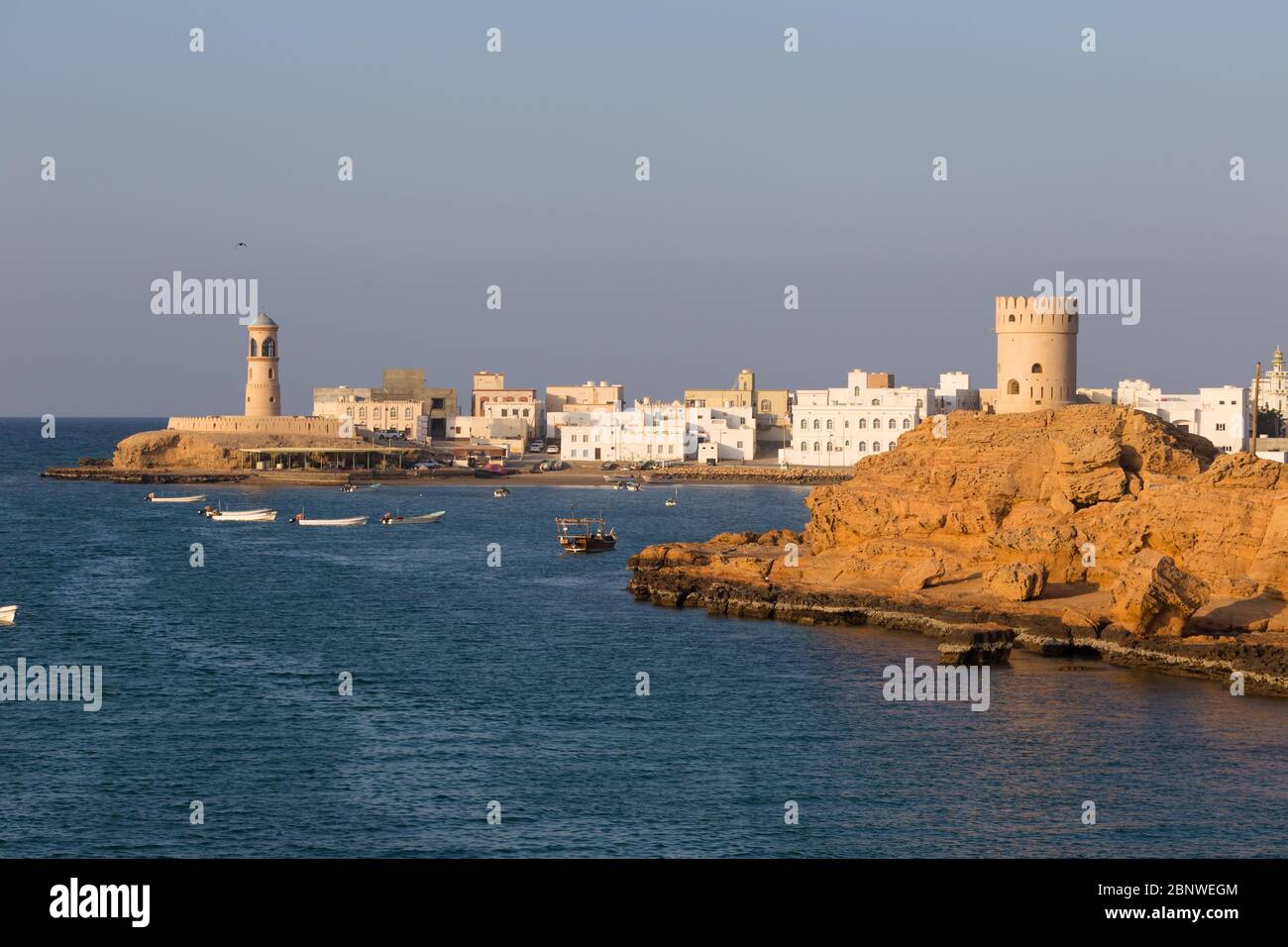 View of the Al Ayjah town, watchtower and lighthouse in the bay of Sur ...