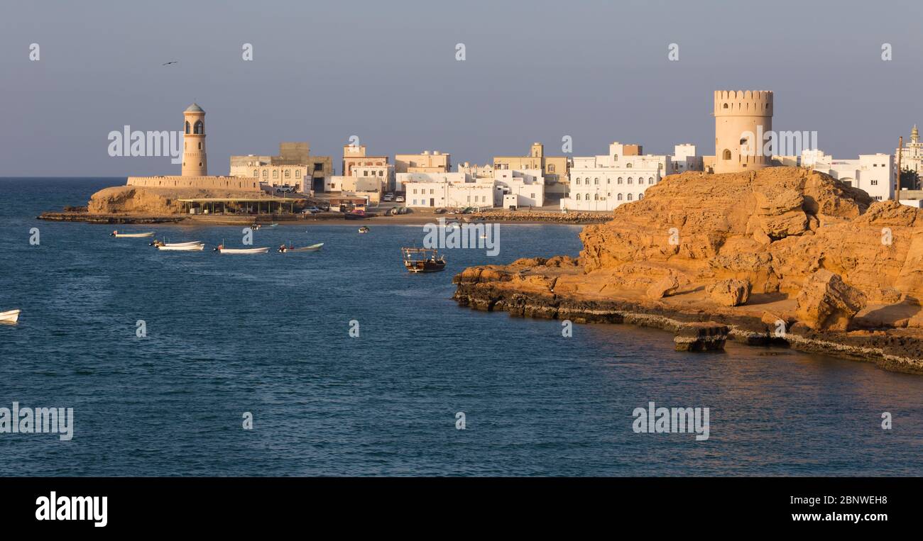 View of the Al Ayjah town, watchtower and lighthouse in the bay of Sur ...