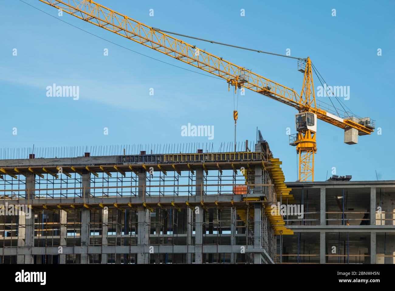 Construction crane near new built house. Construction and developing ...