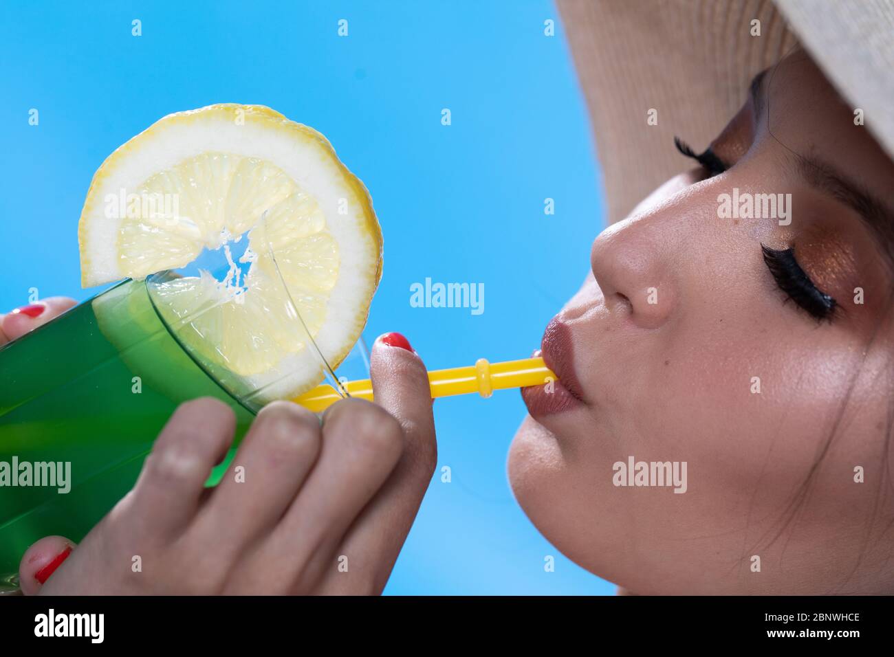 Drinking lemon through straw hi-res stock photography and images - Alamy