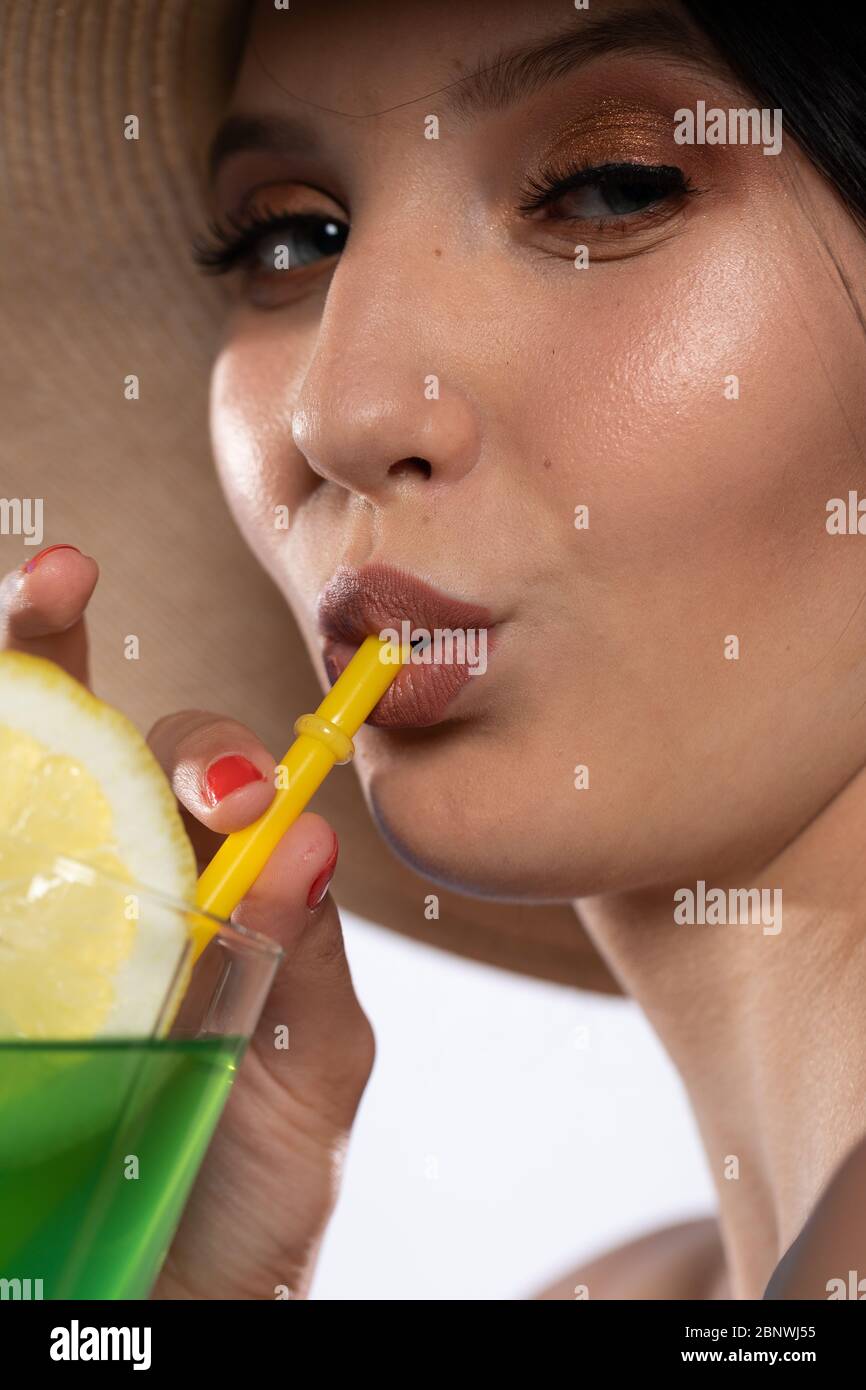 Drinking lemon through straw hi-res stock photography and images - Alamy