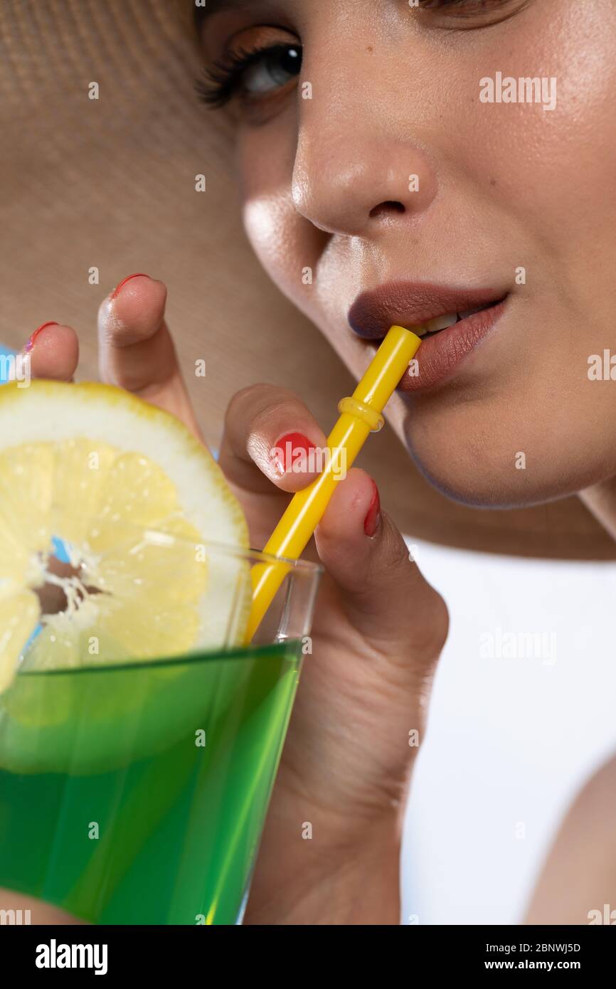 Drinking lemon through straw hi-res stock photography and images - Alamy