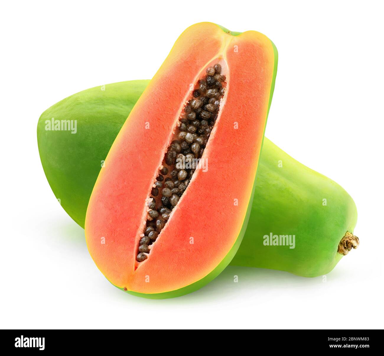 One whole green papaya fruit and a half isolated on white background ...