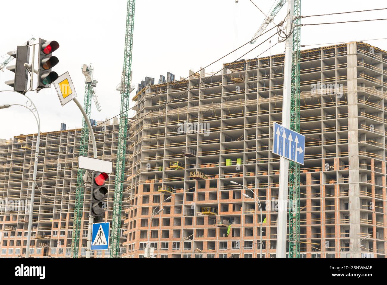 The stopped construction of a high-rise building. Unfinished floors of ...