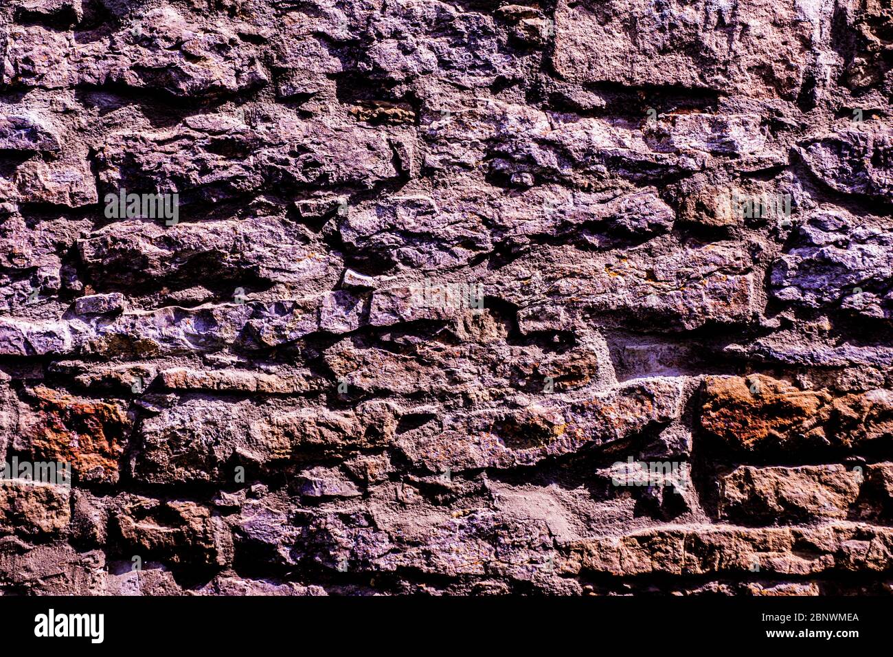 Natural lavender violet colored natural stone wall background texture ...