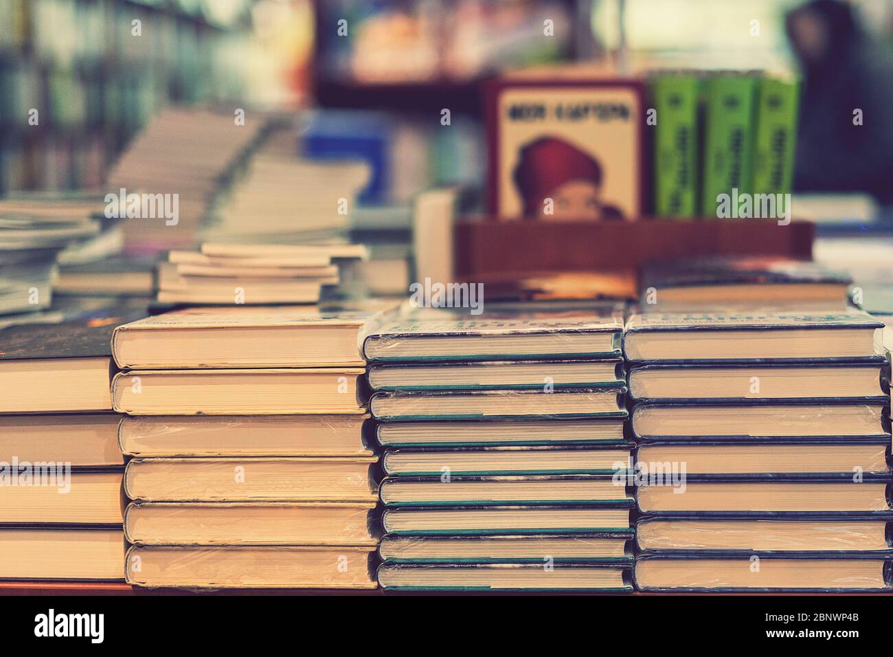 The books are on the shelf in the bookstore. Selective focus. toned ...