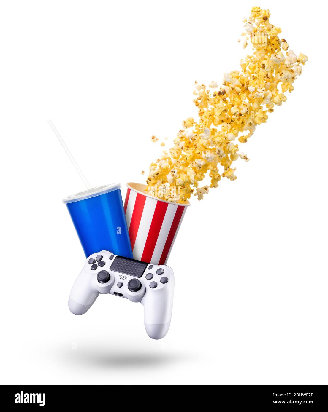 Paper bucket with popcorn, cup of drink and video game joystick on ...