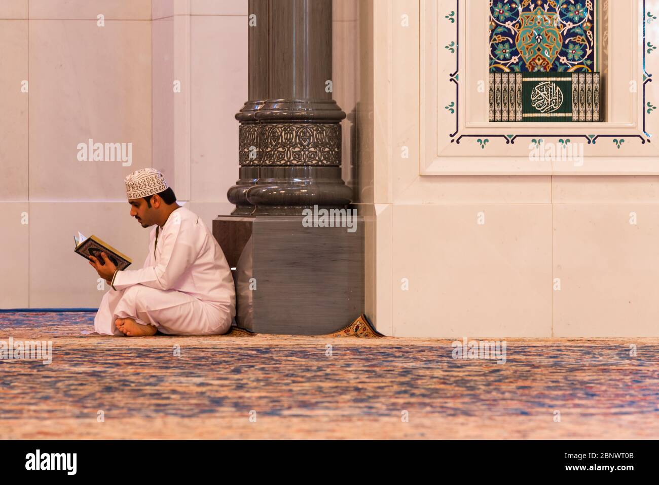 MUSCAT, OMAN - NOVEMBER 30, 2017: a man prays in Sultan Qaboos Grand ...