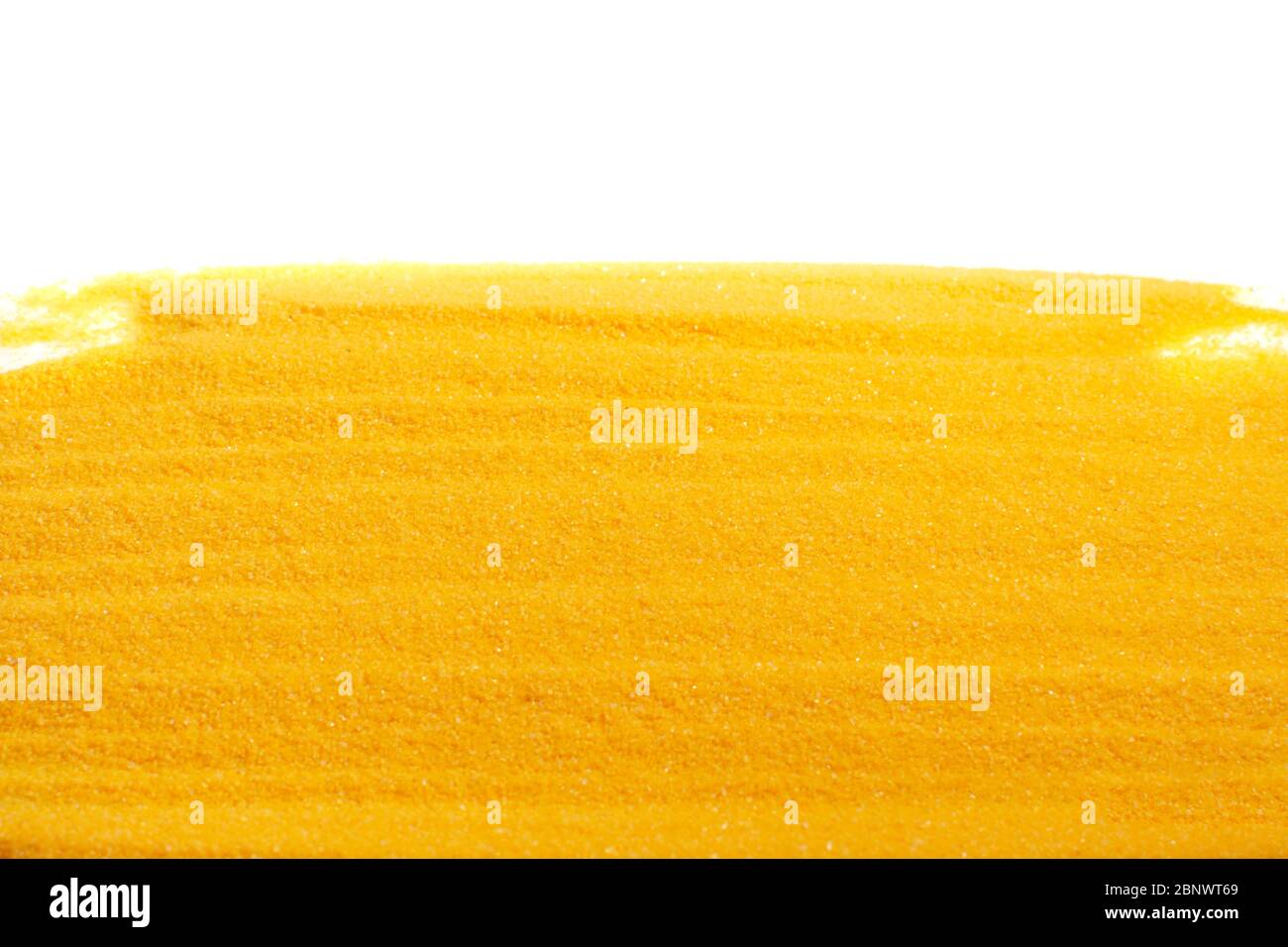 Yellow sand texture and background Stock Photo - Alamy