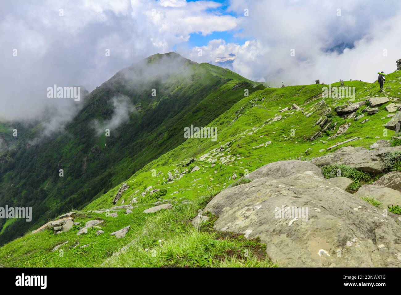 Landscape of a trekker walking at the Chanderkhani pass, India, a very ...