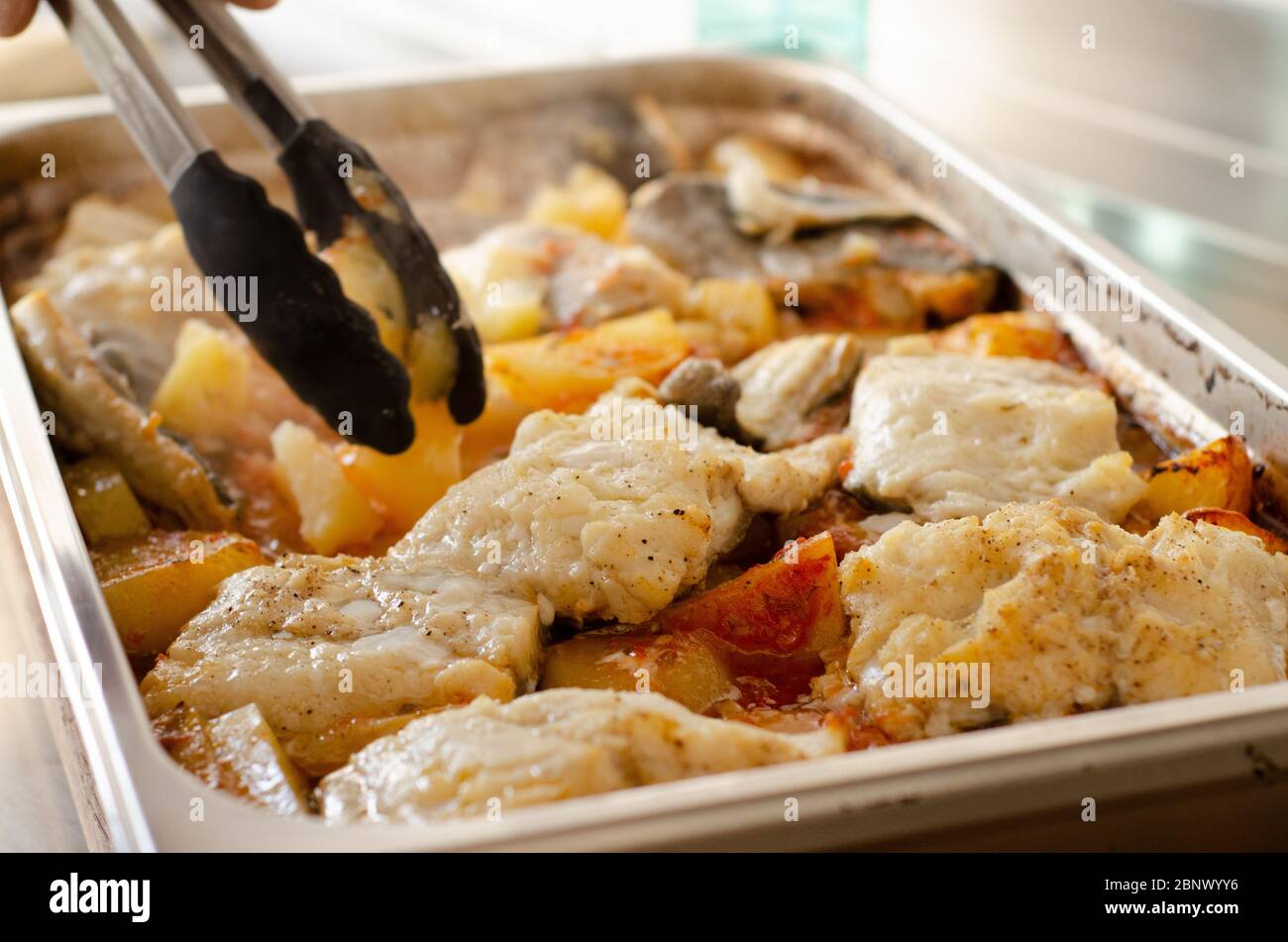 oven pan with fish cooked Stock Photo - Alamy