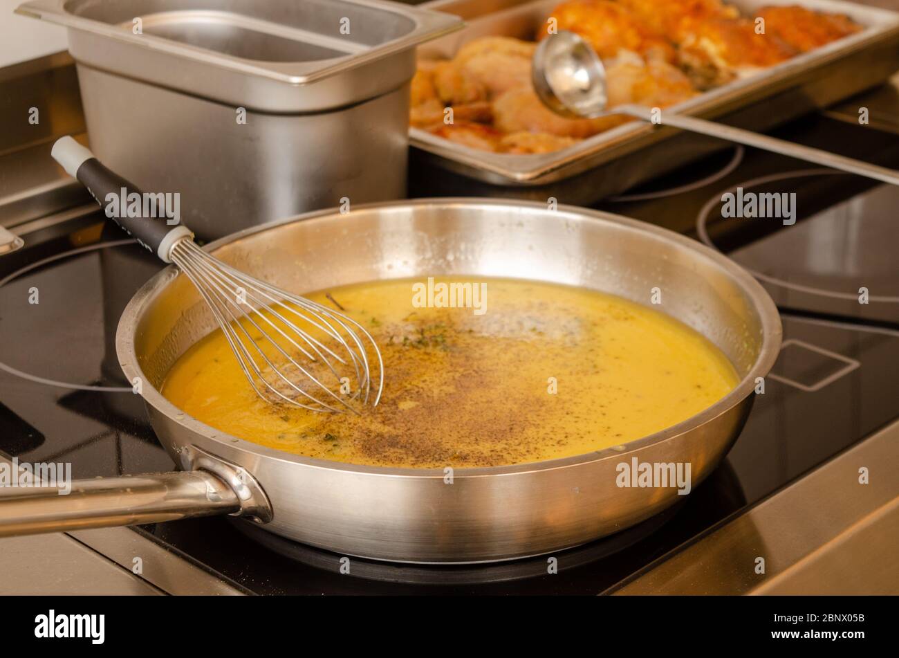 cooking pan prepare sauce with mixer Stock Photo - Alamy
