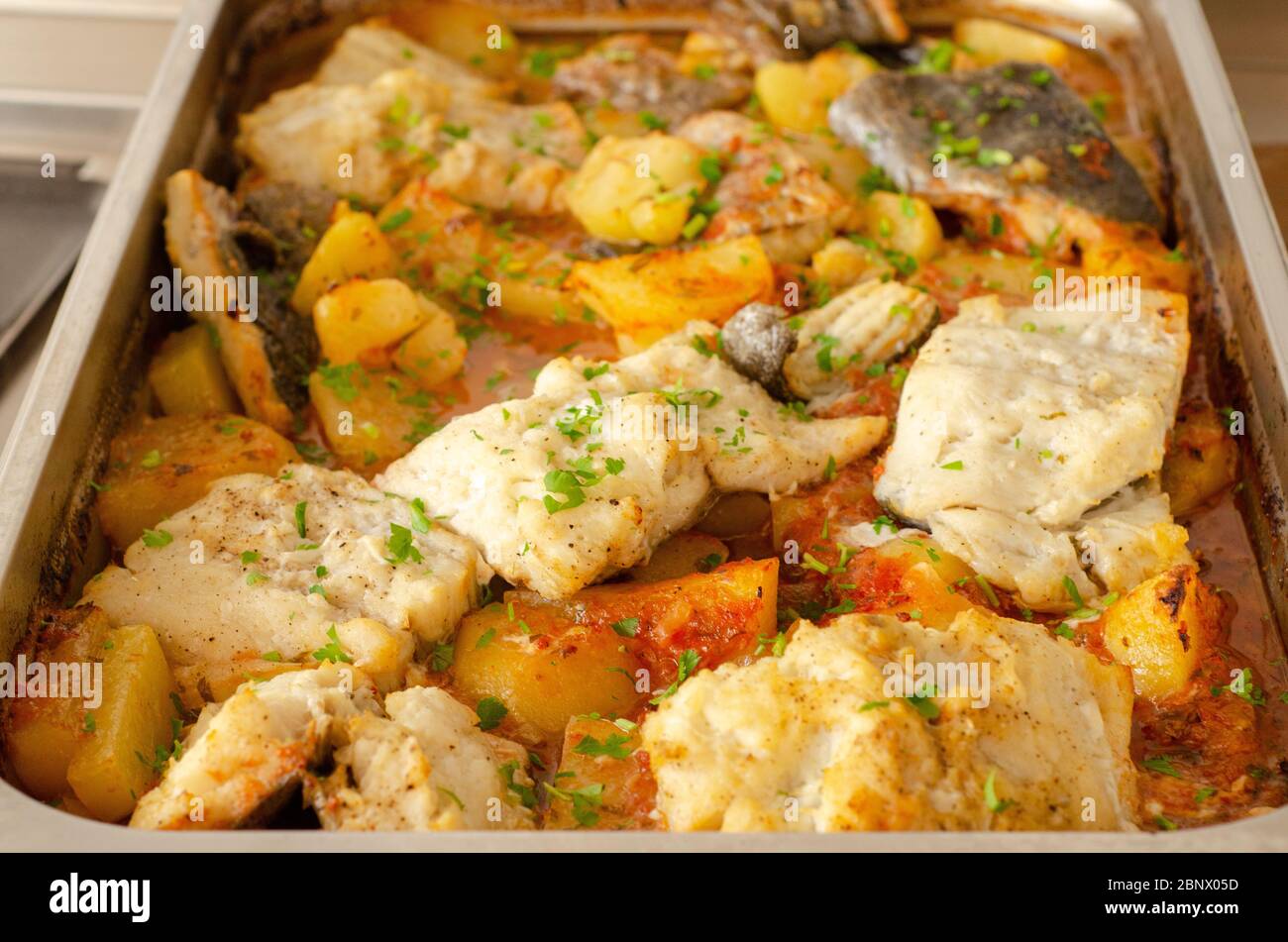 oven pan with fish cooked Stock Photo - Alamy
