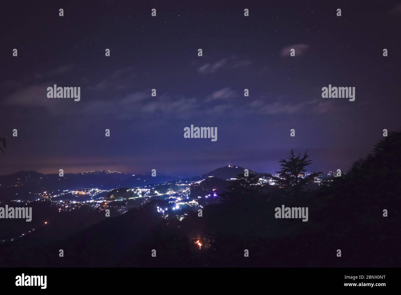 The mountain city of Shimla lit beautifully at night with the city ...