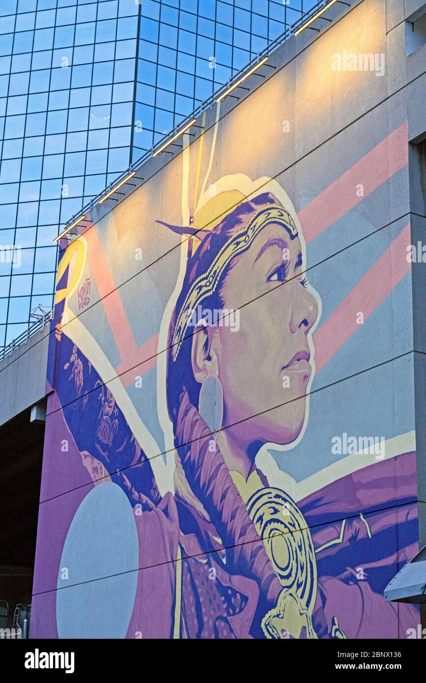 Street art on a building depicting a young Indigenous Cree woman in ...