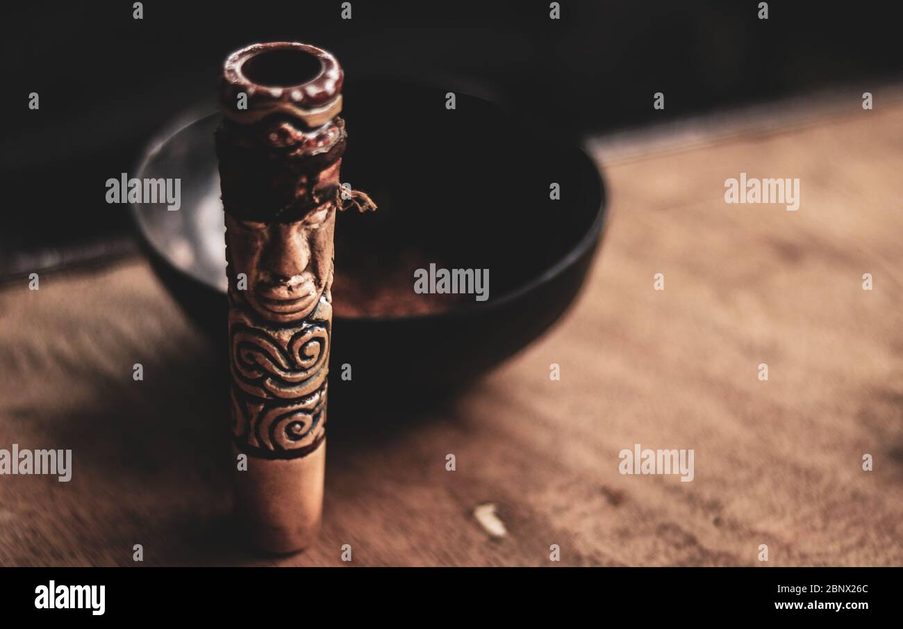 Close up of a brown, vintage Indian pot smoking pipe (chillum) with an ...