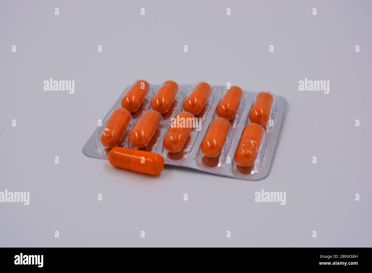 Medical preparations, medical pills in an orange capsule are located on ...