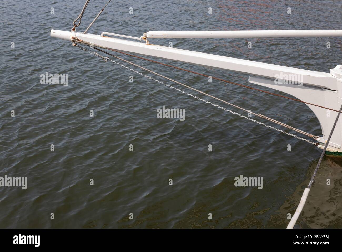 Bowsprit of a sailing vessel, calm sea water, creative copy space ...