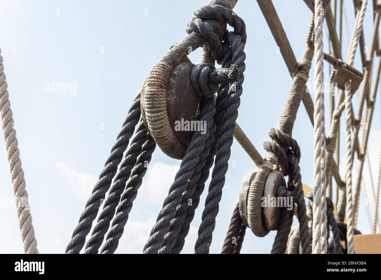 Closeup of block and tackle, wrapped rope and rigging detail on an old ...