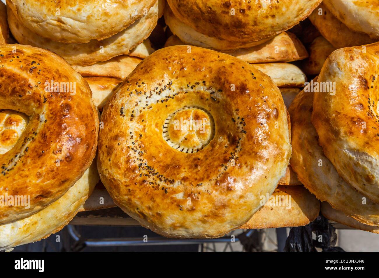 The typical traditional bread for sale in the Chorsu bazaar in Tashkent ...