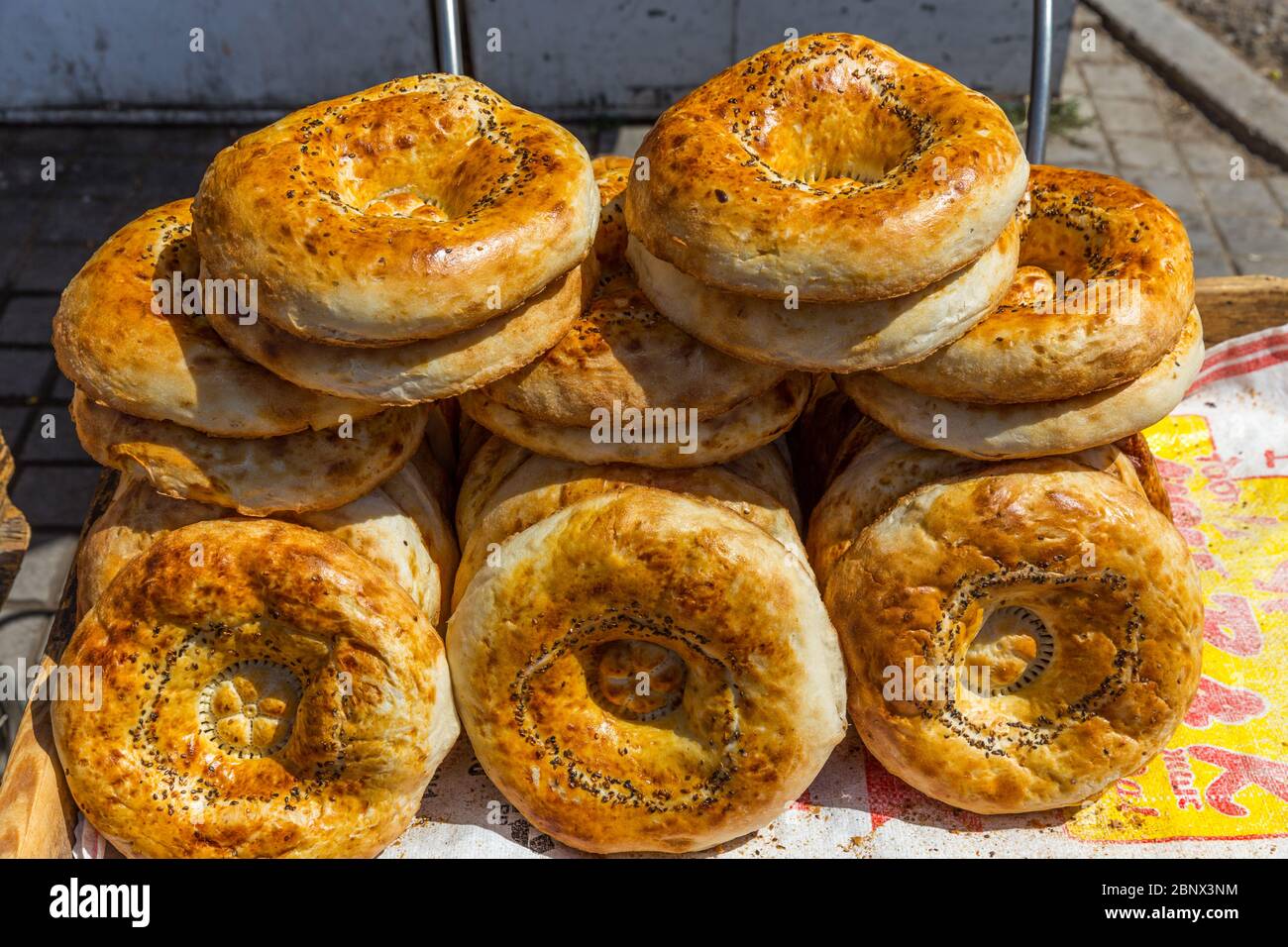 The typical traditional bread for sale in the Chorsu bazaar in Tashkent ...
