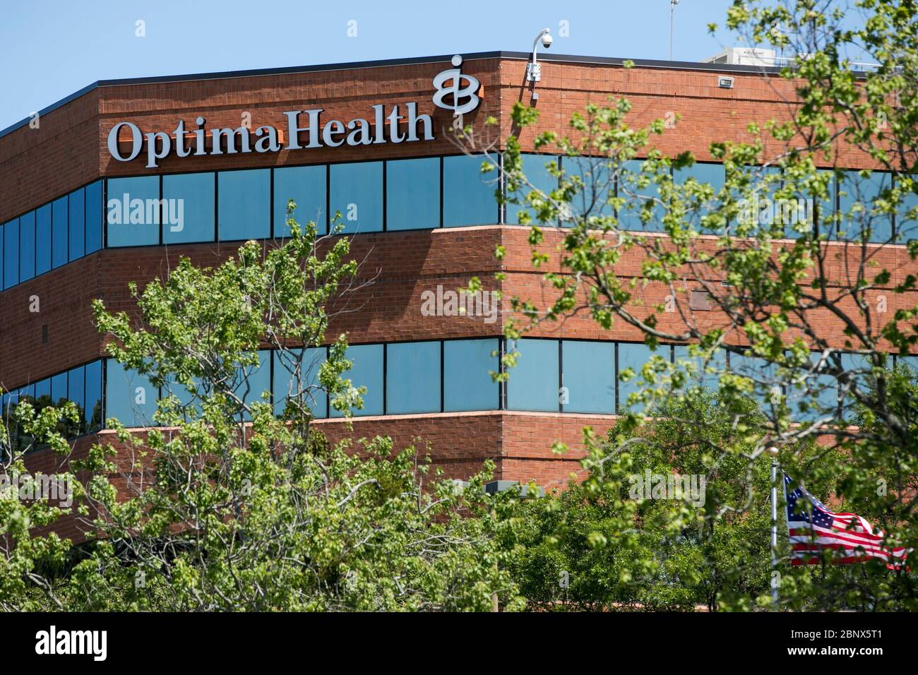 A logo sign outside of the headquarters of Optima Health in Virginia ...