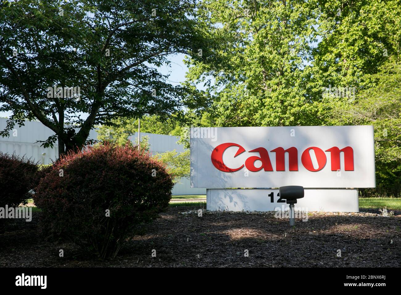 A logo sign outside of a facility occupied by Canon in Newport News ...