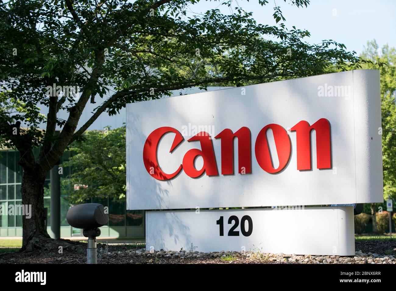 A logo sign outside of a facility occupied by Canon in Newport News ...