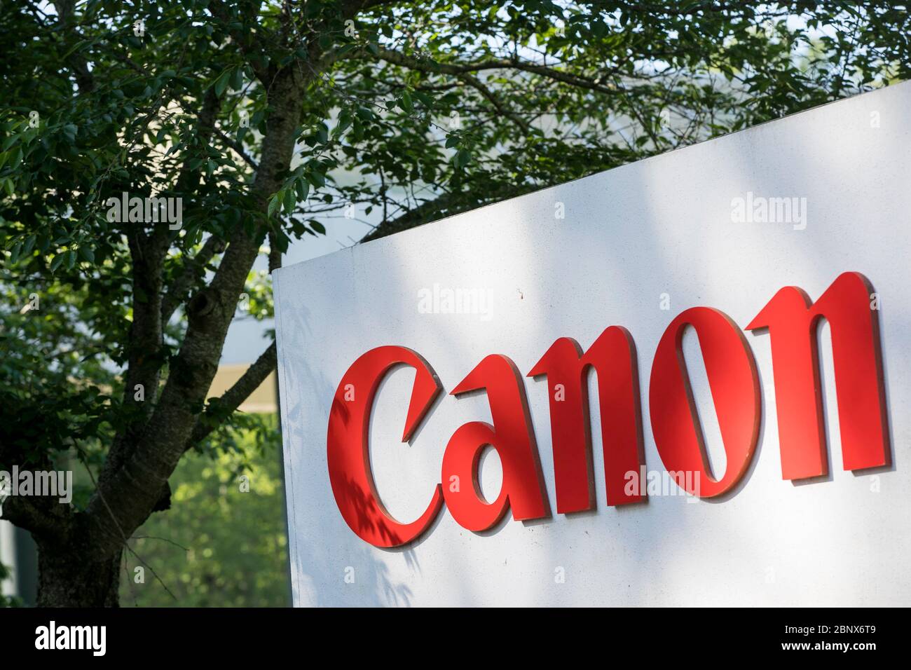 A logo sign outside of a facility occupied by Canon in Newport News ...