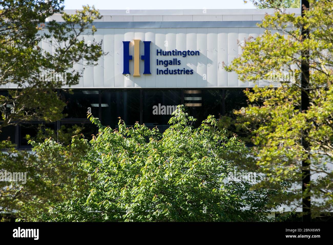 A logo sign outside of a facility occupied by Huntington Ingalls ...