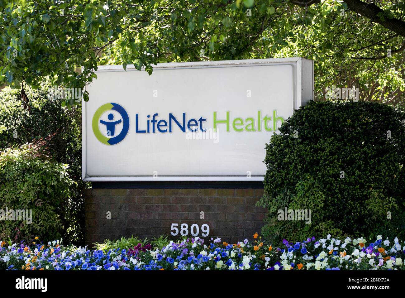A logo sign outside of a facility occupied by LifeNet Health in ...