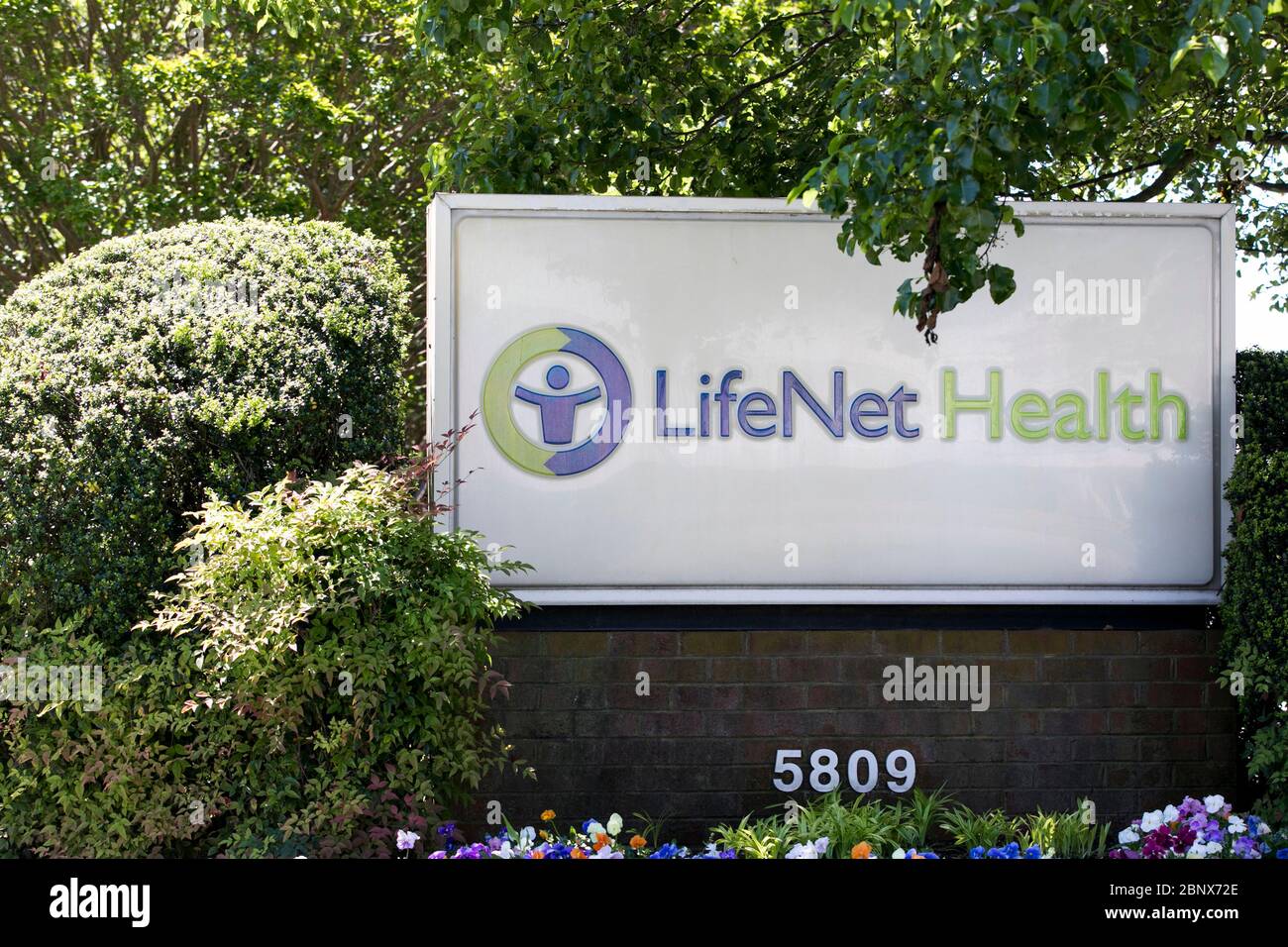 A logo sign outside of a facility occupied by LifeNet Health in ...