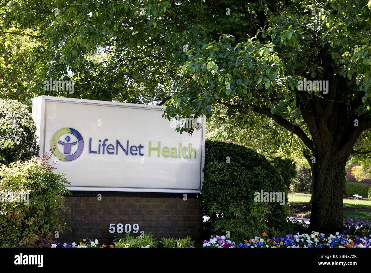 A logo sign outside of a facility occupied by LifeNet Health in ...