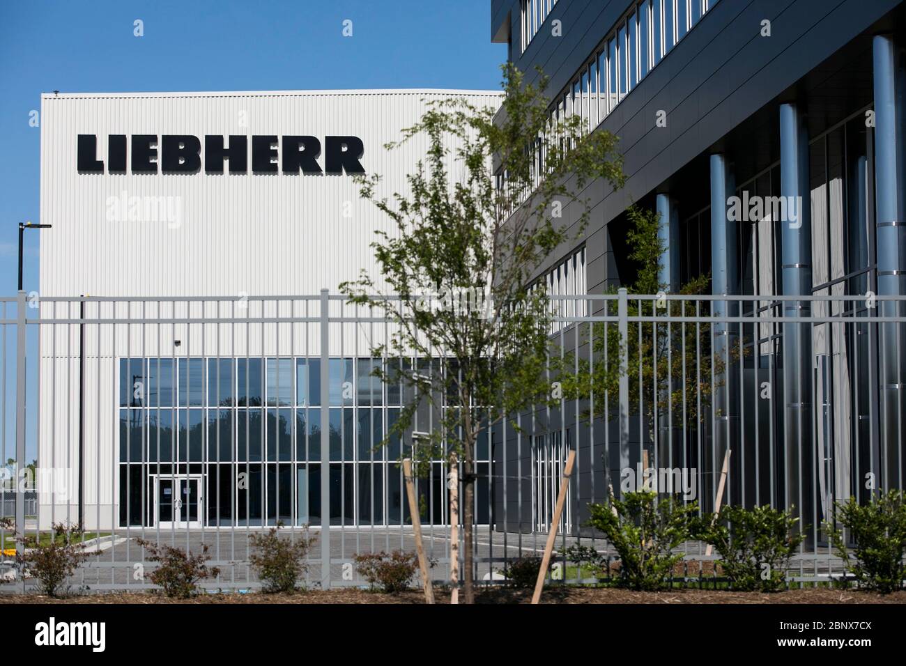 A logo sign outside of a facility occupied by The Liebherr Group in ...