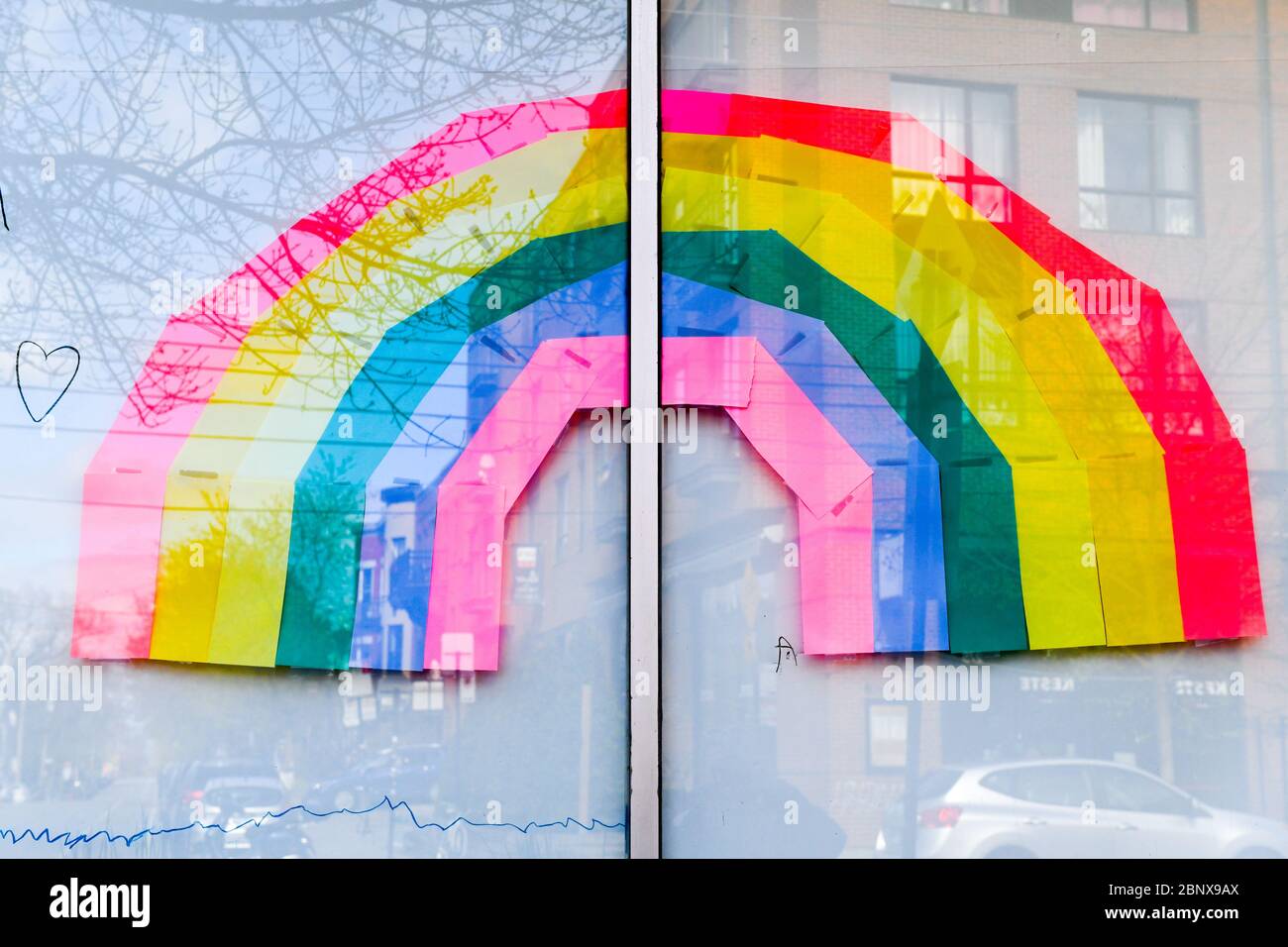 Rainbow of hope drawing on a window in Montreal Canada during the ...