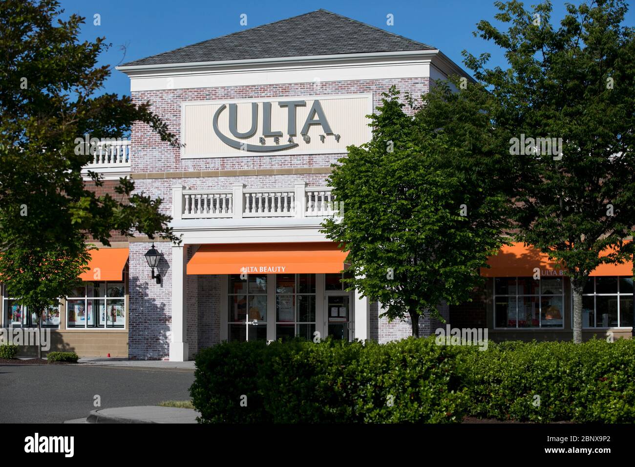 A logo sign outside of a Ulta Beauty retail store location in ...