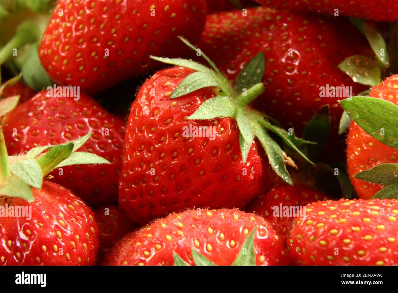 Red summer strawberries, fresh fruit macrophoto Stock Photo - Alamy