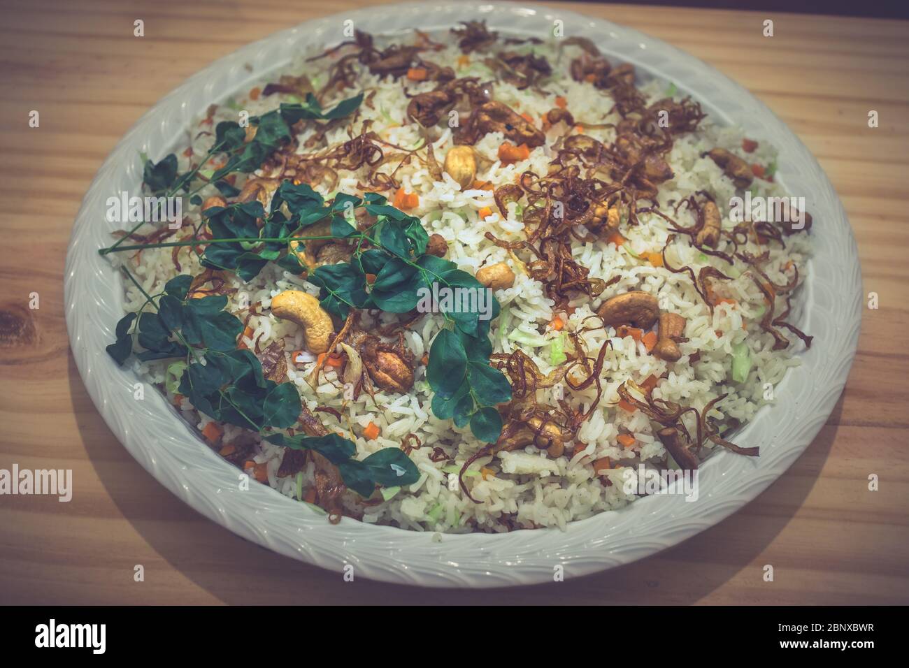 Basmati fried rice plate on a dinner table Stock Photo - Alamy
