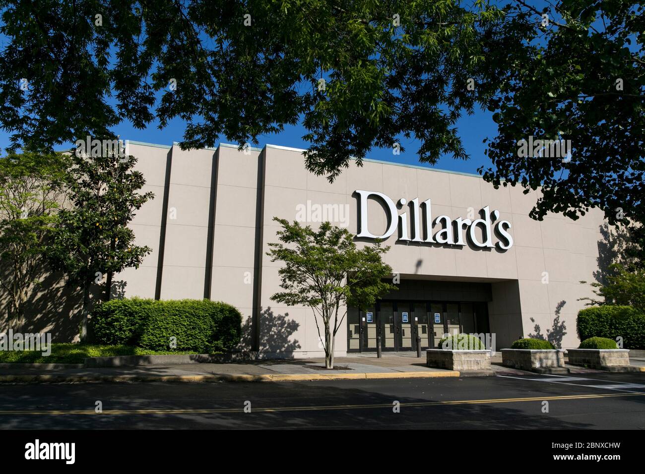 A logo sign outside of a Dillard's retail store location in Newport ...