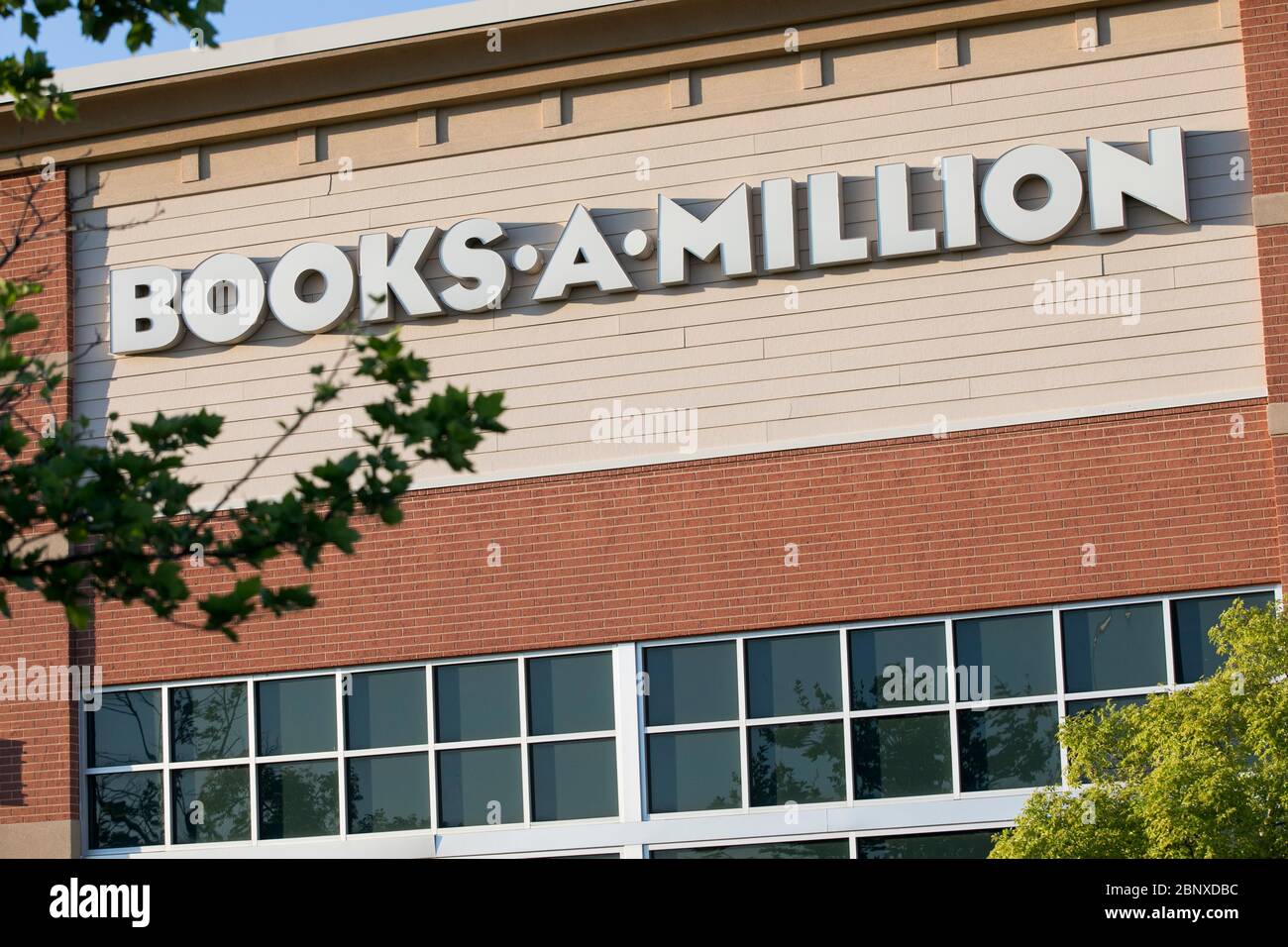 A logo sign outside of a Books-A-Million retail store location in ...