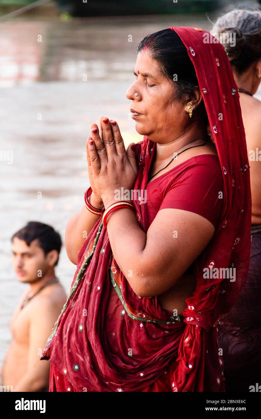 Woman praying in sunrise in india hi-res stock photography and images ...