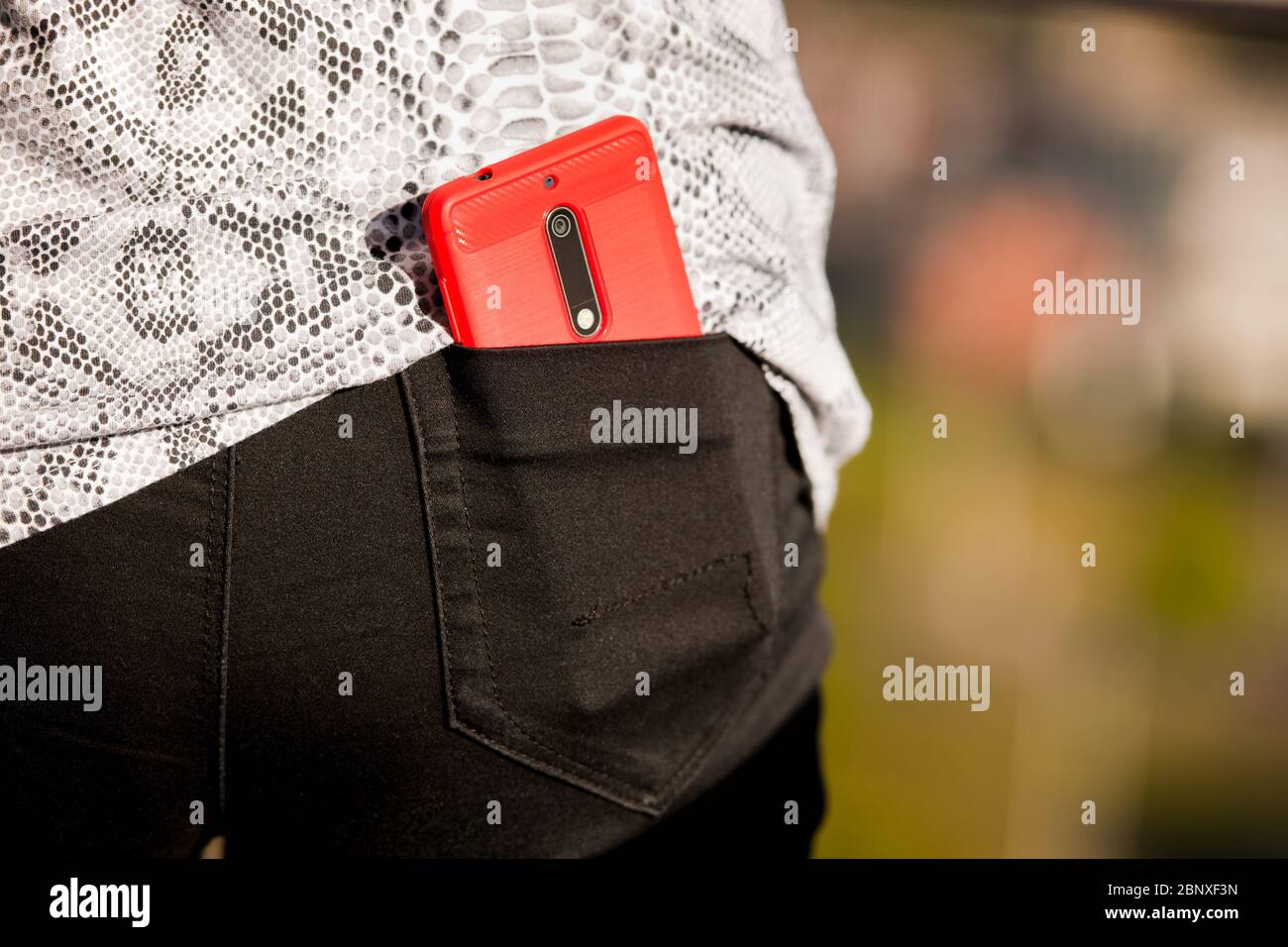 phone in back pocket is very sensitive to theft Stock Photo - Alamy