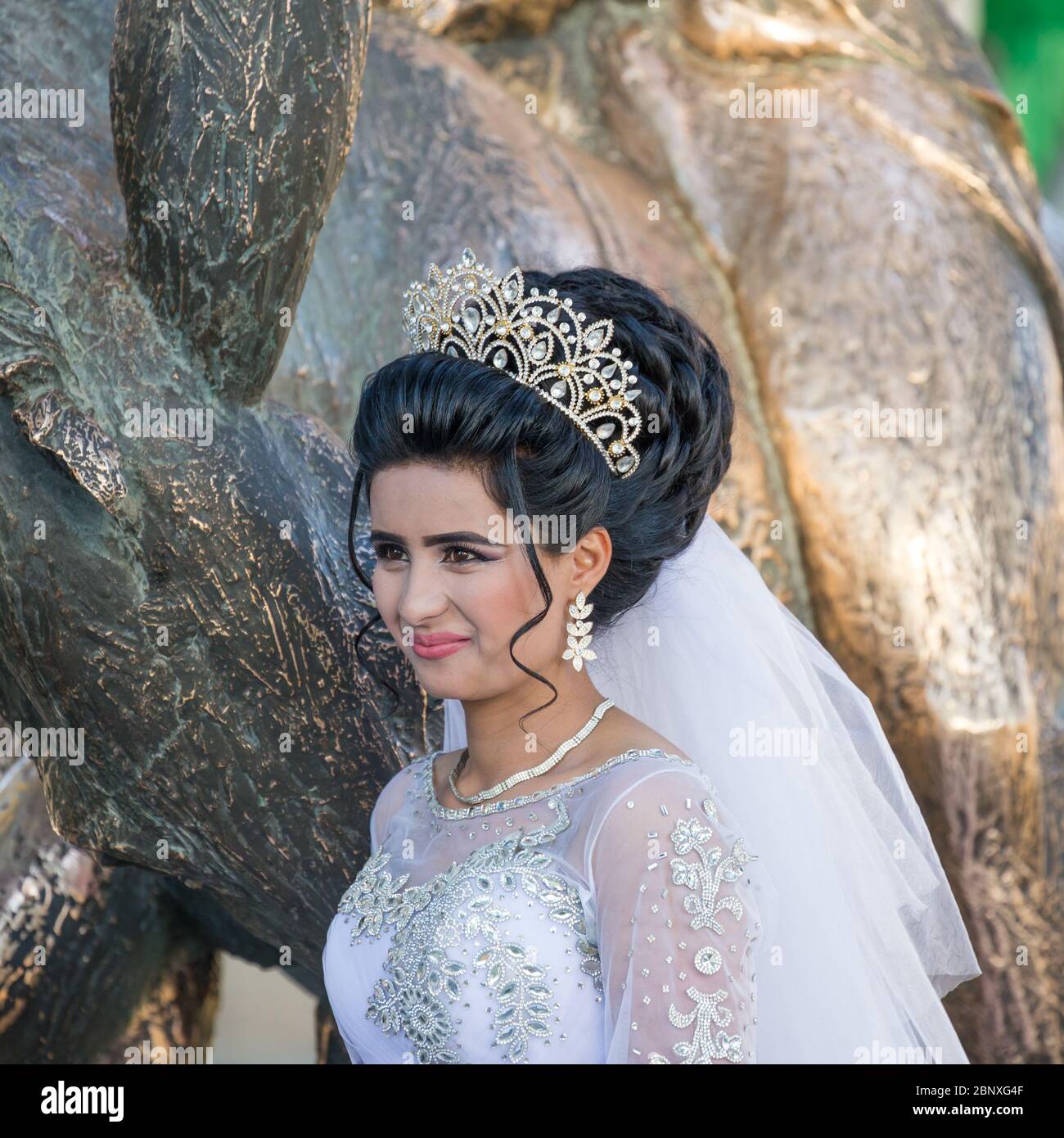BUKHARA, UZBEKISTAN - AUGUST 27, 2016: a bride after the celebration of ...