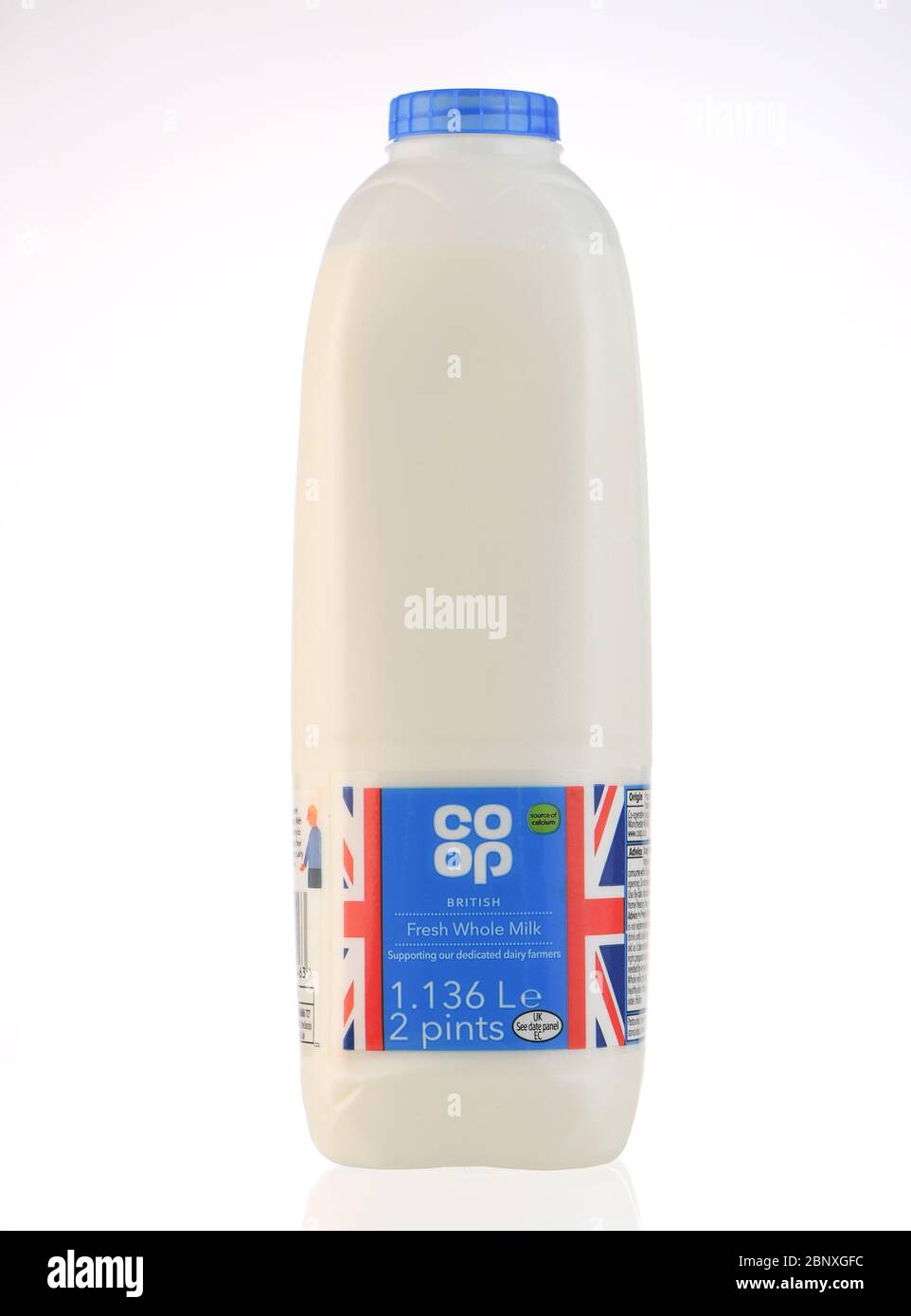 Co-op milk plastic bottles isolated against a white background with a ...